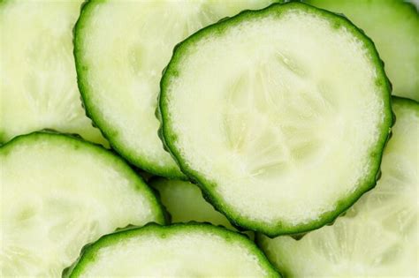 Premium Photo Round Slices Of Sliced Cucumber Closeup
