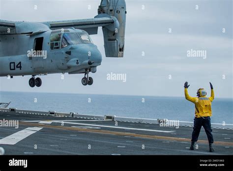 Aviation Boatswains Mate Directs Marines In An Mv 22 Osprey For