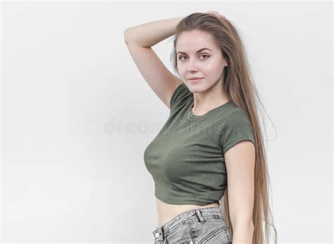 Nice Girl With Beautiful Breasts In A Green T Shirt Posing On Ca Stock