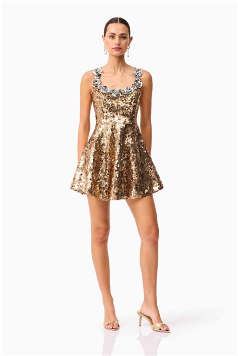 Noelle Sequin Mini Dress In Gold Sequin Fabrication And Flared Skirt