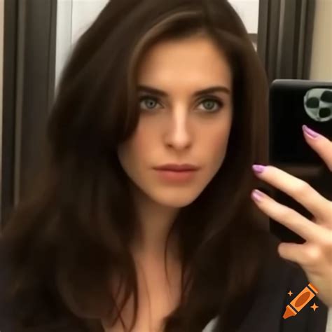 Candid Selfie Of A Woman With Dark Brown Hair And Emerald Eyes In The
