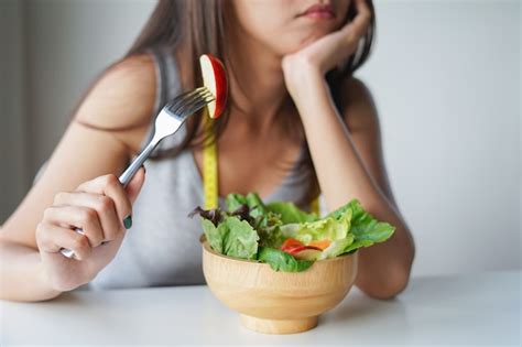 Premium Photo Asian Woman Boring To Eat Salad Or Diet Food Diet Concept