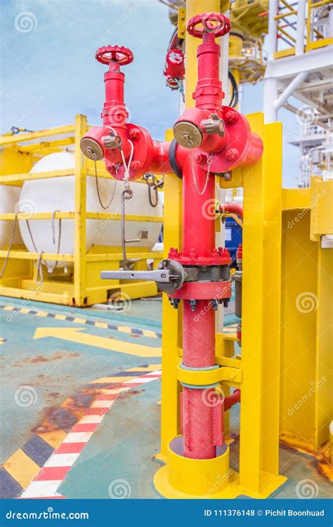 Red Firefighting Hydrant Over The Grey Wall Of Staircase Equipment For Connecting Firehose