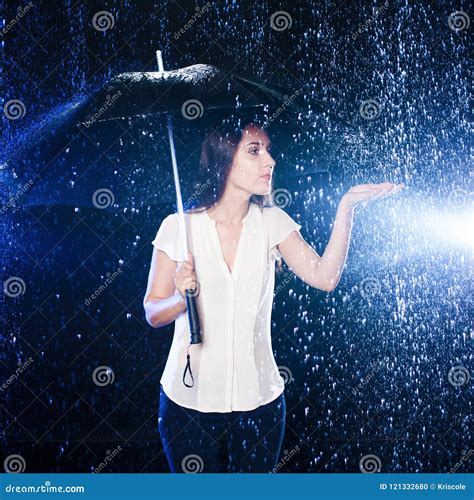 Woman Under Umbrella Girl Holding Hand Out To Touch The Raindrops