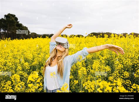 Beautiful Young Blonde Cheerful Woman Wearing A Vitual Reality Glasses