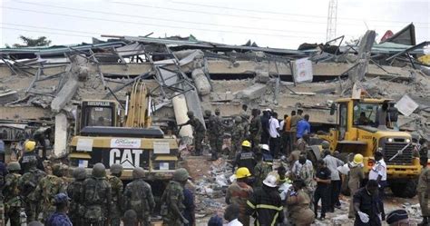 Rescuers At The Scene Of The Melcom Achimota Collapse Incident Source