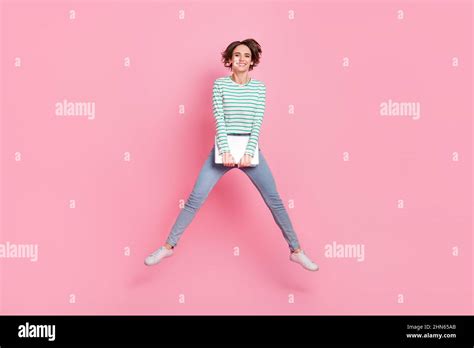 Full Length Photo Of Cute Young Bob Hairdo Lady Jump Hold Laptop Wear