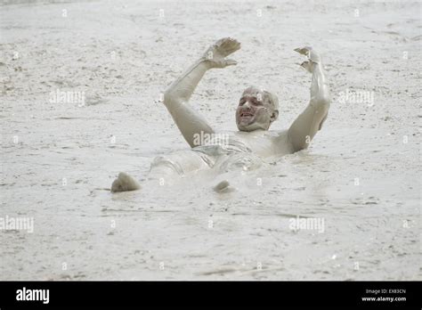 People Enjoy Hot Weather And Bathe In The Mud Pool With Kaolin In