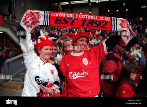 Liverpool Football Fans Proudly Display Their Team Colours At Anfield