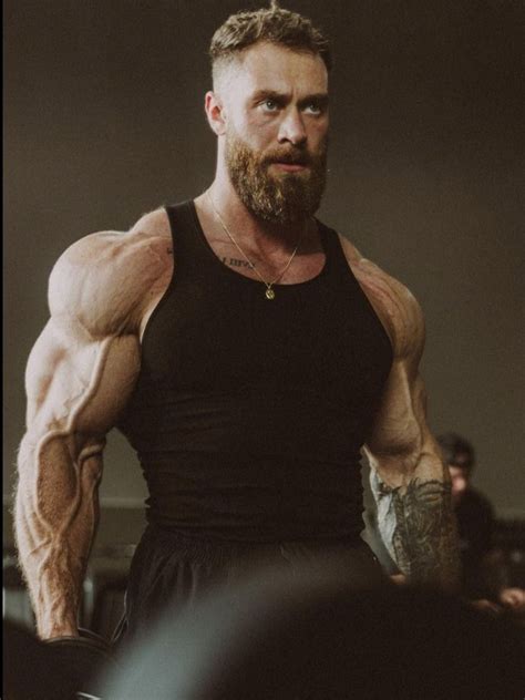 Chris Bumstead Leaning Down For Mr Olympia Mr Olympia Biceps