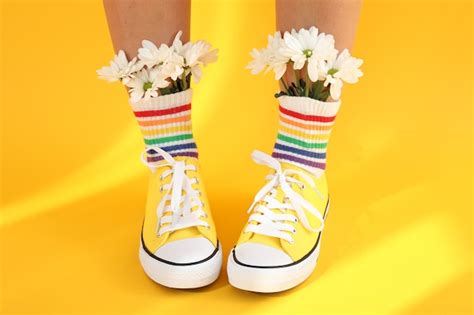 Premium Photo Female Legs In Rainbow Socks With Flowers And In