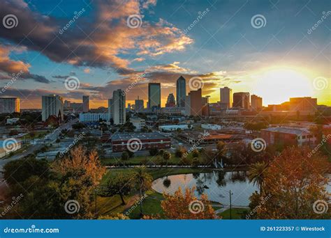 Jacksonville Cityscape With Greenery And A Reflective Lake During