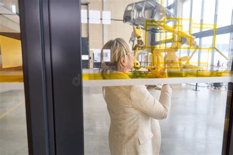 Engineer Programming Industrial Robotic Arm In High Tech Laboratory For
