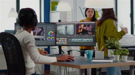 Black Videographer Putting On Headset Editing Movie Using Post Production Software Working In