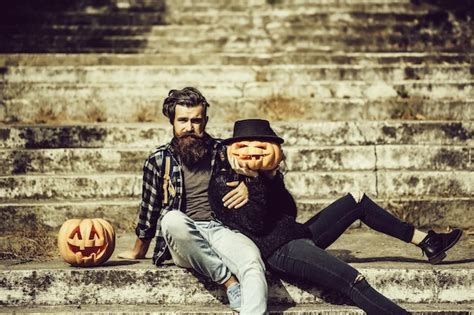 Premium Photo Halloween Couple With Pumpkin