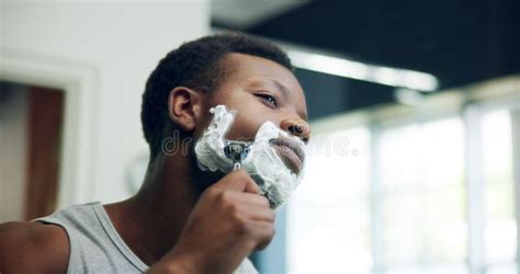 Grooming Hygiene And Shaving With Black Man In Bathroom Of Home For Daily Or Morning Routine