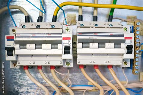 Two Electric Three Phase Switches Connected By Wires On A Metal Background Stock Photo Adobe