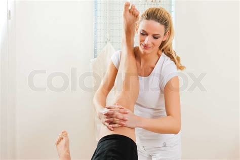 Patient At The Physiotherapy Doing Physical Therapy Stock Image