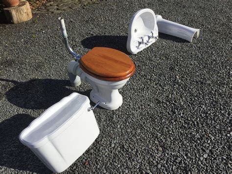 Cottage Style Wash Basin And Pedestal Toilet With Cistern In