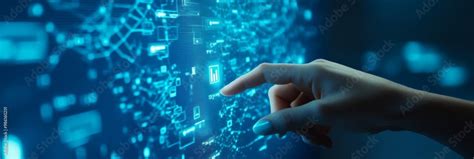 finger pointing at a glowing digital screen with complex technological