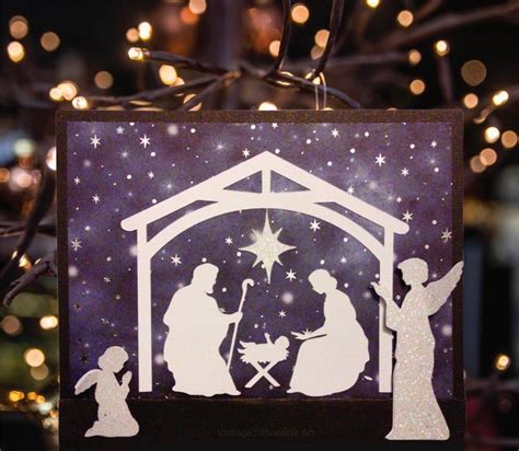 A Paper Cut Nativity Scene With The Birth Of Jesus And Baby Jesus