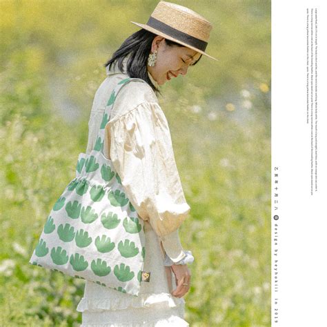 何几原创绿色春夏新品单肩斜挎抽绳花包包女帆布包女文艺小清新风虎窝淘