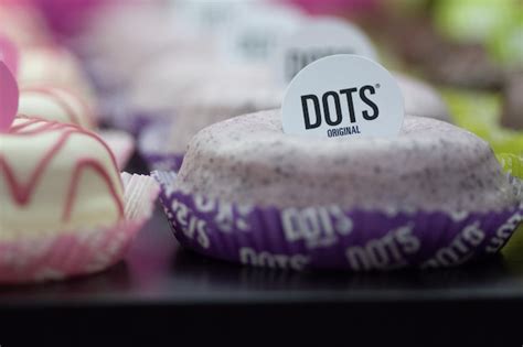 Premium Photo An Evocative Image Captures The Essence Of Dots Original Pastry Donut