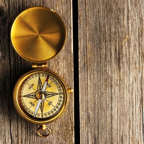 Premium Photo Antique Compass Over Wooden Background