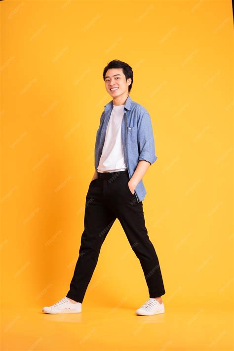Premium Photo Full Body Image Of Asian Man Posing On Yellow Background