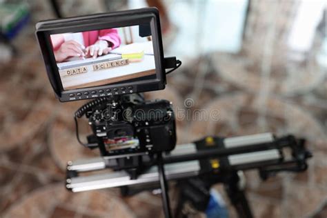 Digital Camera With External Monitor On Camera Slider Filming Woman