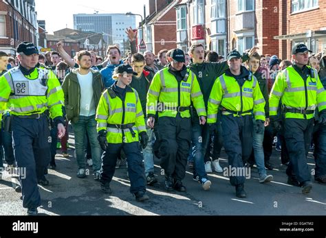 Devon And Cornwall Police Escort Football Fans Along Wells Street Stock