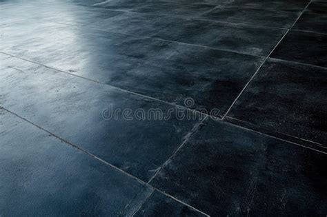 A Black Tiled Floor With A Red Fire Hydrant Suitable For Use In Urban