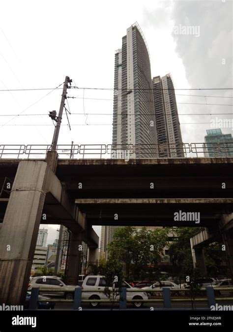 Overpass Over Traffic And A Sky Scaper Building In Novaliches Manila