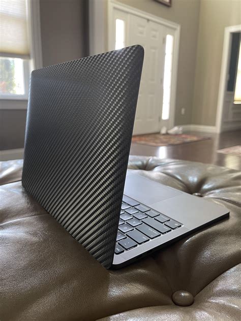 My New M Macbook Pro With A Gray Carbon Fiber Skin My Mid Retina Display Macbook Has