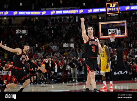 Chicago Bulls Josh Giddey Follows Through While Watching His Game
