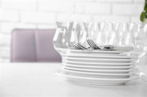 Premium Photo Clean Plates Glasses And Cutlery On White Table