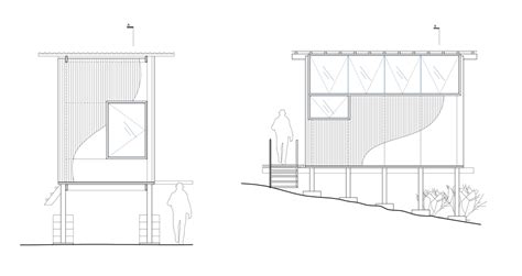 Charred Cabin By DRAA Is A Blackened Timber Shelter On Stilts