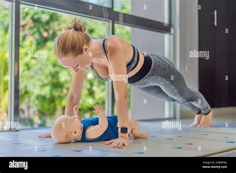 A Mother Works Out With Her 3 Month Old Baby Incorporating Fitness And Bonding Into A Joyful