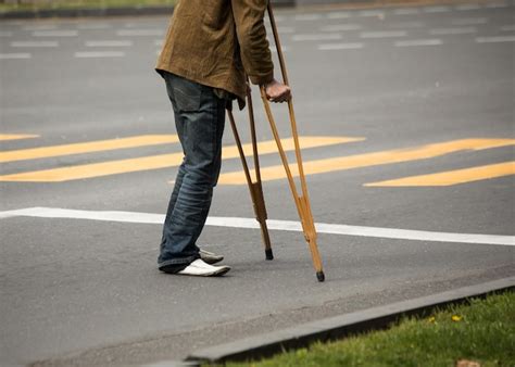 Premium Photo Broken Foot Using Crutches
