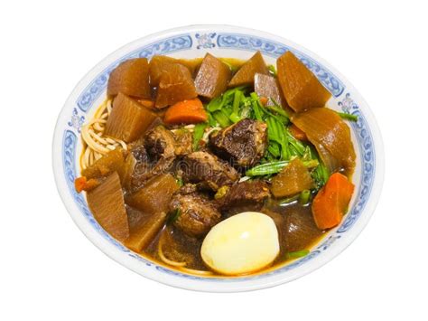 Hearty Beef Noodle Soup With Vegetables And Boiled Egg On White