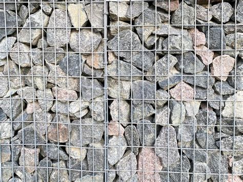 Premium Photo Texture Of Metal Wire Mesh And Large Stones