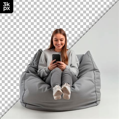 Premium Psd A Woman Is Sitting On A Bean Bag Chair With A Phone In