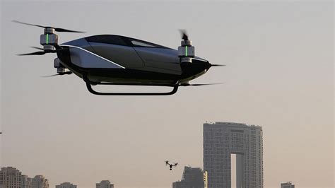 Fly Above Traffic THIS Chinese Firm Tests Electric Flying Taxi In Dubai Aviation News Zee News