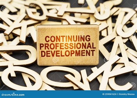 Among The Wooden Letters Is A Sign With The Inscription Continuing Professional Development