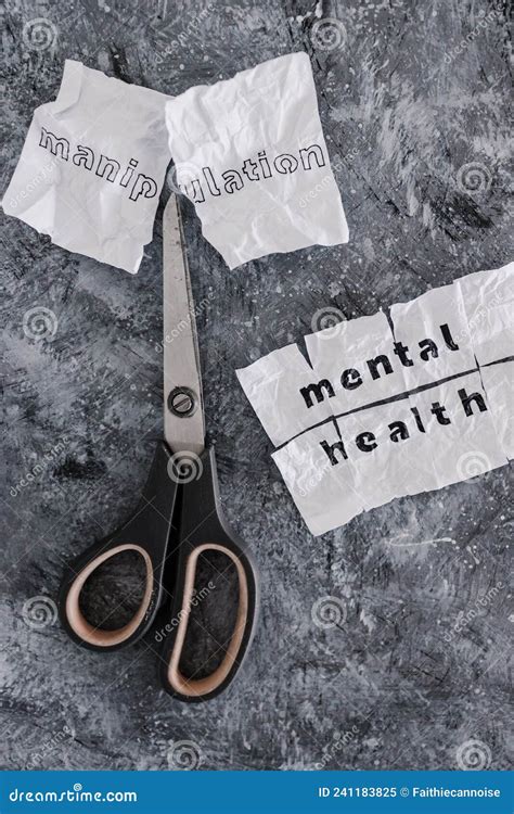 Manipulation Text On Crumpled Piece Of Paper Which Is Getting Cut With Scissors Next To Mental