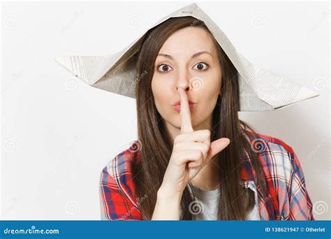 Portrait Of Young Beautiful Woman In Newspaper Hat Saying Hush Be Quiet