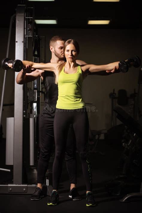 Sporty Man And Woman With Great Abdominal Muscles In Black Sportswear
