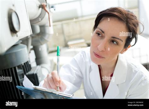 Female Consumption Factory Engineer Writing Report Stock Photo Alamy