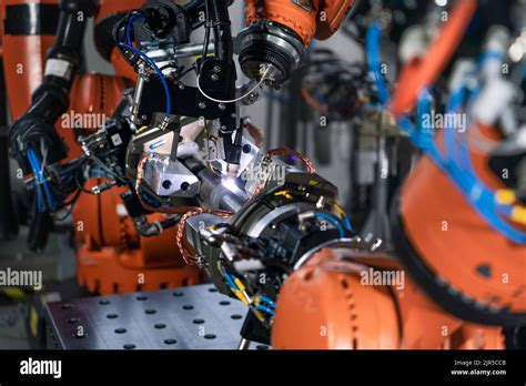 Robotic Arm At Industrial Manufacture Factory Automated Production