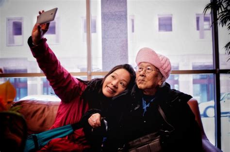 Premium Photo Smiling Mid Adult Woman Taking Selfie With Mother